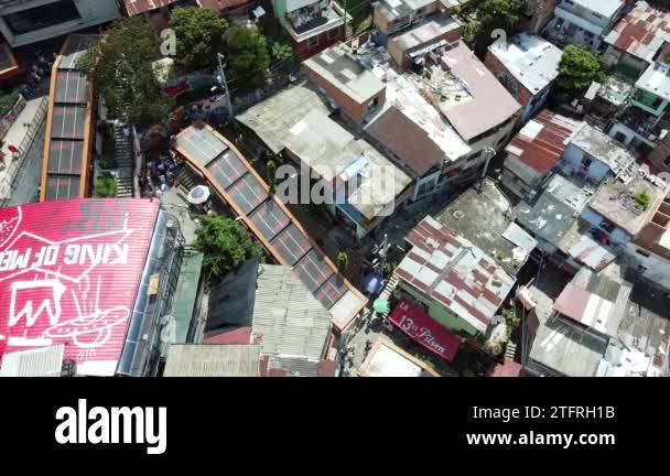 Medellin, Colombia, drone aerial view of Comuna 13 slums. Once one of ...