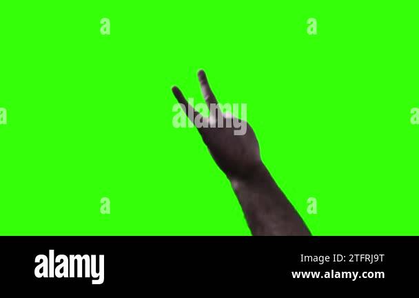 Man shows Two Fingers or Peace Gesture on the Background of Green ...