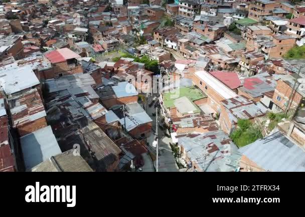 Medellin, Colombia, drone aerial view of Comuna 13 slums, favela. Once ...