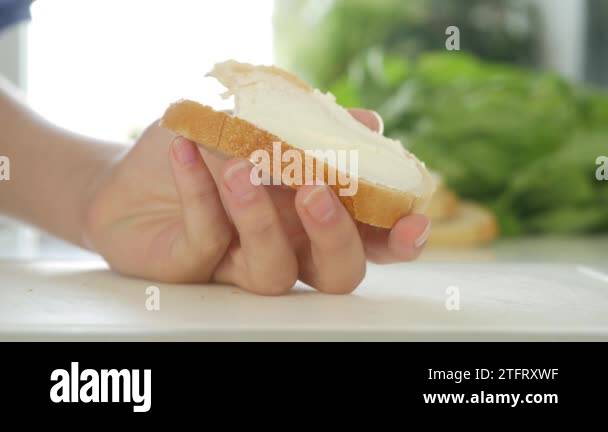 Child Eating Sandwich at Breakfast, Kid Hand with Cheese Cream Spread ...