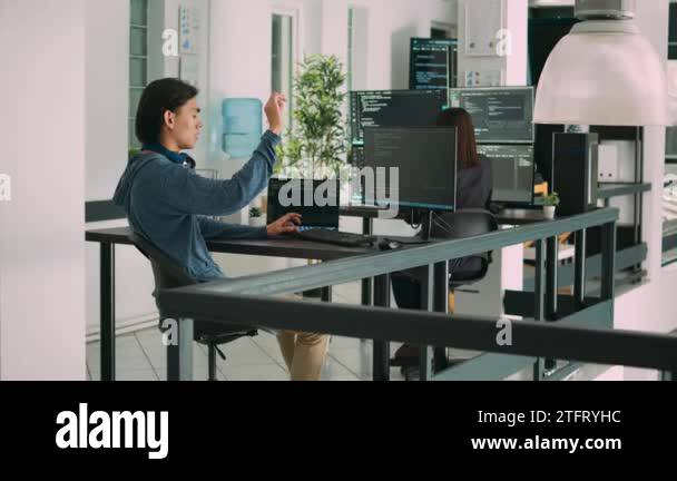Asian Web Developer Working With Hologram And Augmented Reality To