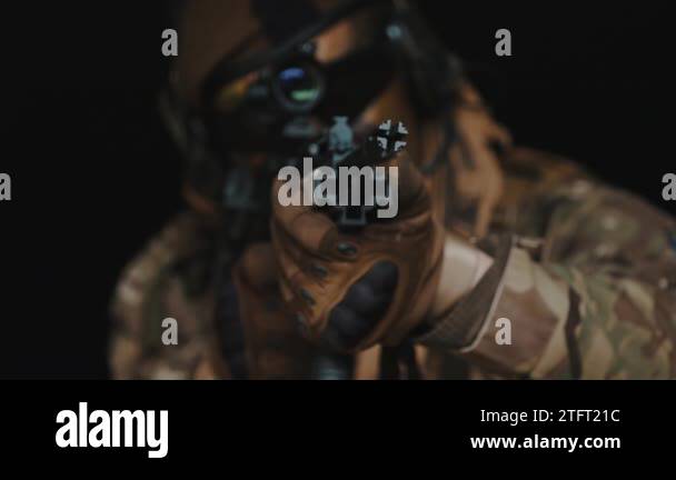 Decisive aim of a trained soldier eye aiming with a rifle scope during ...