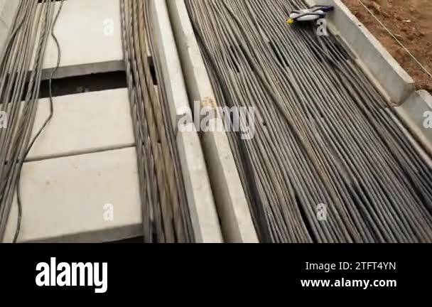 Laying of high voltage power cables into concrete duct Stock Video ...