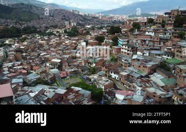 Medellin, Colombia, drone aerial view of Comuna 13 slums. Once one of ...