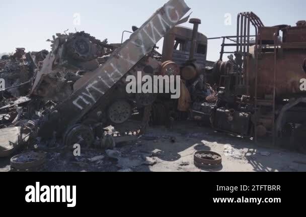 Burnt military equipment after a missile attack. Abandoned rusty military equipment. City of ...