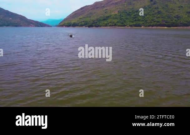 Man crossing the prado tolima dam in colombia by boat. concept of ...