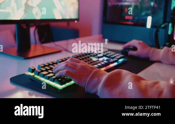 Gamer hands, gamer hands on RGB keyboard, closeup of pro cyber sport ...