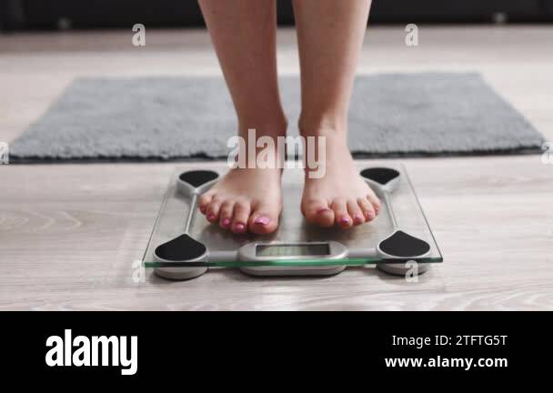 Female On Scales Measure Weight. Fit Girl Legs Step Bathroom Scale ...