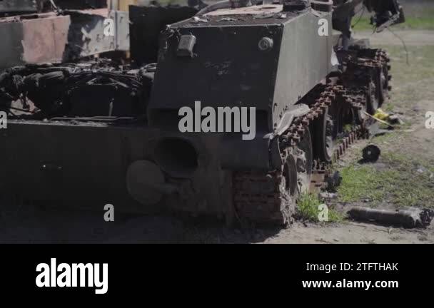 Burnt military equipment after a missile attack. Abandoned rusty military equipment. City of ...