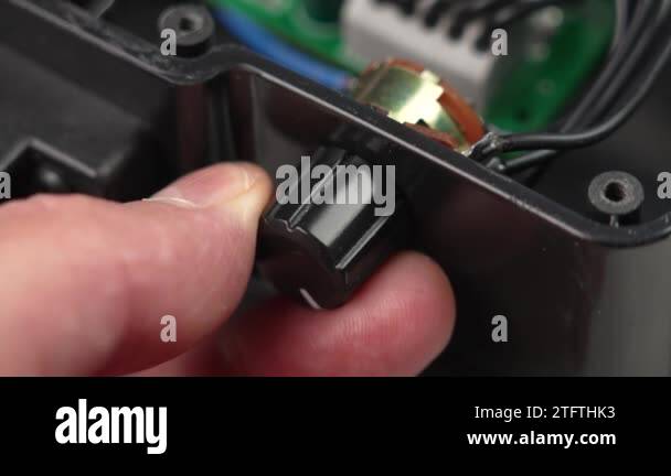 Checking and testing of power by turning the black button of an ...