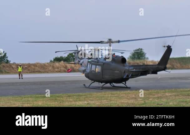 Piacenza Italy JUNE, 15, 2022 Retro-style military helicopter takes off ...