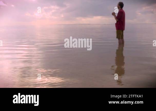 Praying in water Stock Videos & Footage - HD and 4K Video Clips - Alamy