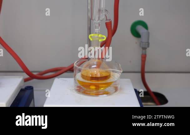 Mixing colored solution with a magnetic stirrer. Formation of a ...