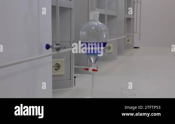 Separating funnel laboratory glassware used in liquid-liquid ...