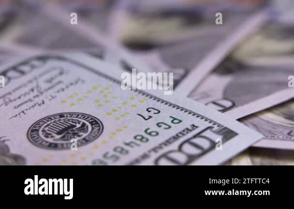 Heap of one hundred dollar bills spread out in a fan rotates. New 100 ...