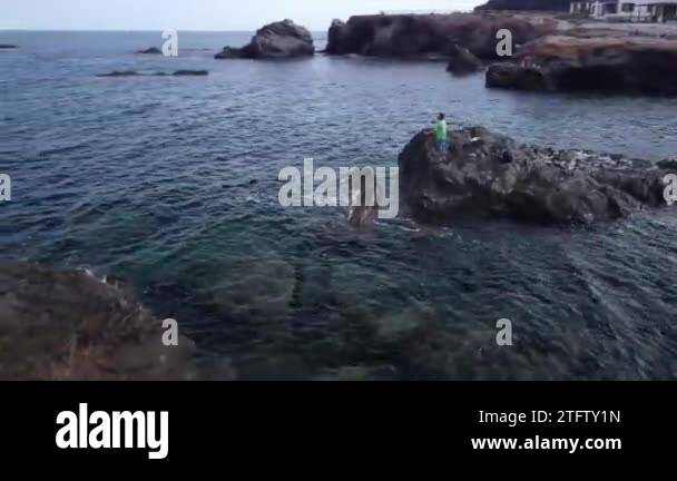 Angler fishing in the spinning modality, picking up the rod and ...