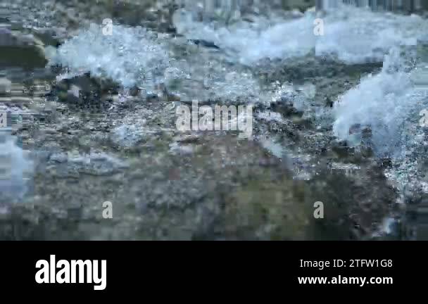 mountain river flowing through stone rapids in the Carpathians in slow ...