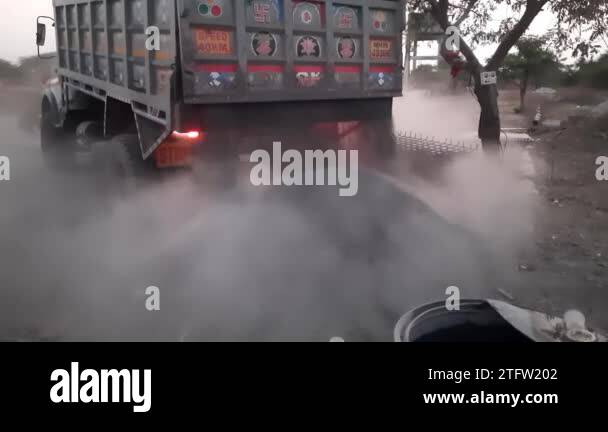 Grey Crushed Stone Kapchi (Powder) is unloaded in a dumper truck at the ...