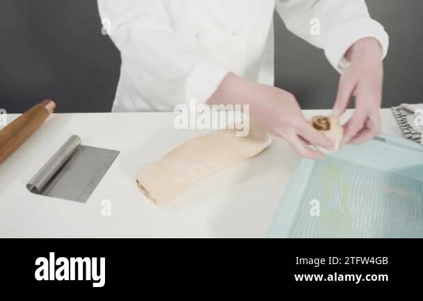 Process of cooking Cinnabon rolls. Ingredients on a white kitchen ...