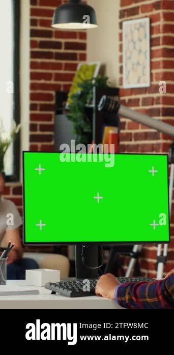 Vertical video: Diverse team of employees analyzing computer with ...