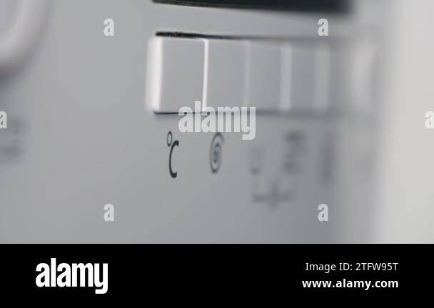 Close Up Shooting with a Hand Setting the Function Buttons from the ...