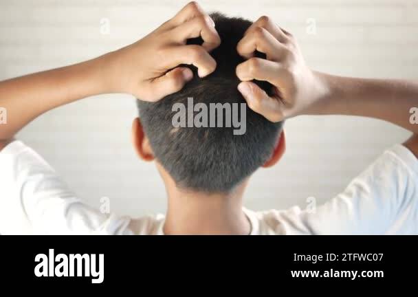 teenage boy Scratching Head Against black background Stock Video ...