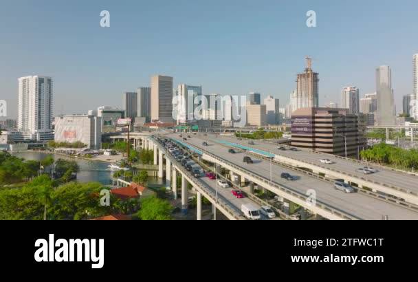 Cars driving on elevated multilane highway. Modern high rise apartment ...
