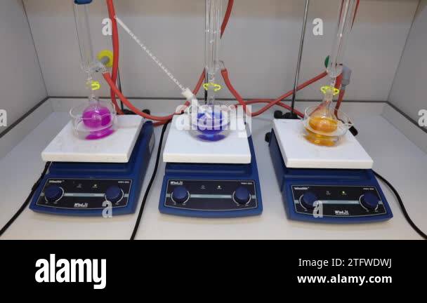 Mixing colored solution with a magnetic stirrer. Formation of a ...