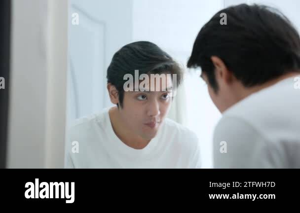 Health concept of 4k Resolution. Asian man washing his face with water ...