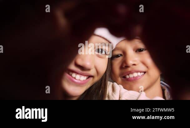 Close up happy young mother her little adorable cheerful daughter faces ...