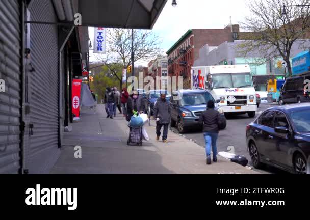This video shows views aerial views of people walking in the Bronx with ...