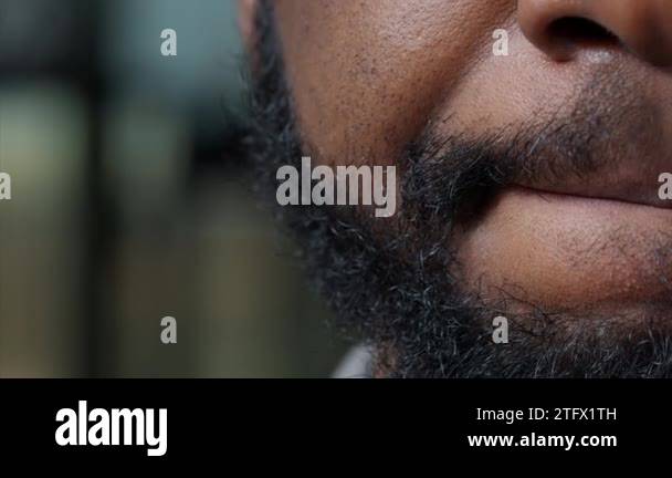 Macro shot of male model moving his lips and showing half of face Stock ...