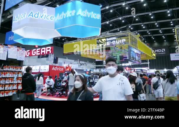 People walking and shopping in Commart Thailand 2022 computer technology event at Bitec Bangna ...