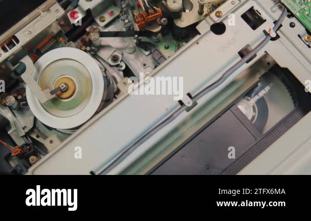 video cassette is loaded in the VCR, Magnetic videotape in the VCR mechanism Stock Video Footage ...