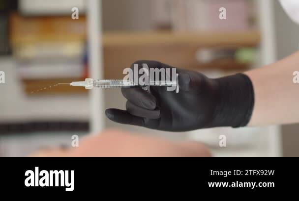 Syringe for injections. The doctor makes an injection Stock Video ...