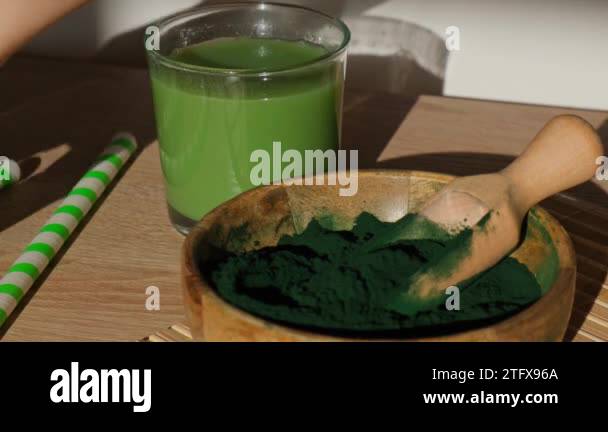 Blue-green algae Chlorella and spirulina powder add to drink. Super ...