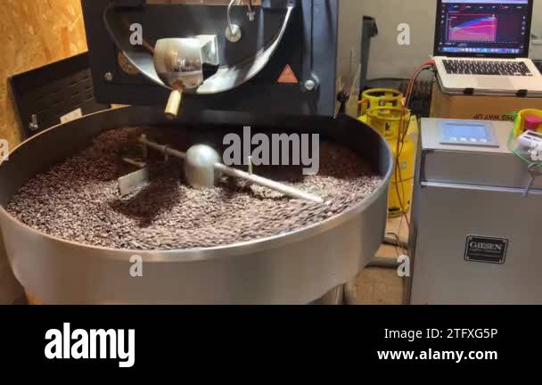 Roasting in action, coffee roaster setup with computer to monitor the ...