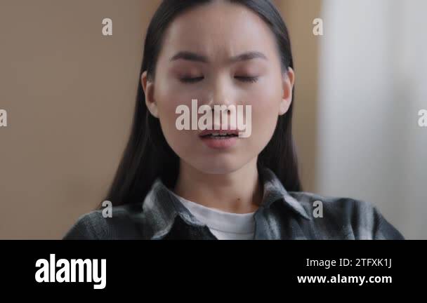 Female emotional portrait Asian girl shock surprise disappointment sadness bad mood negative ...