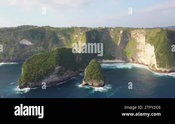 Dramatic aerial drone footage of the famous Kelingking beach, aka T Rex ...