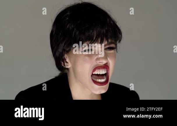 Screaming mouth, emotional young woman screaming. Mad and sad furious shout. Angry stressed ...