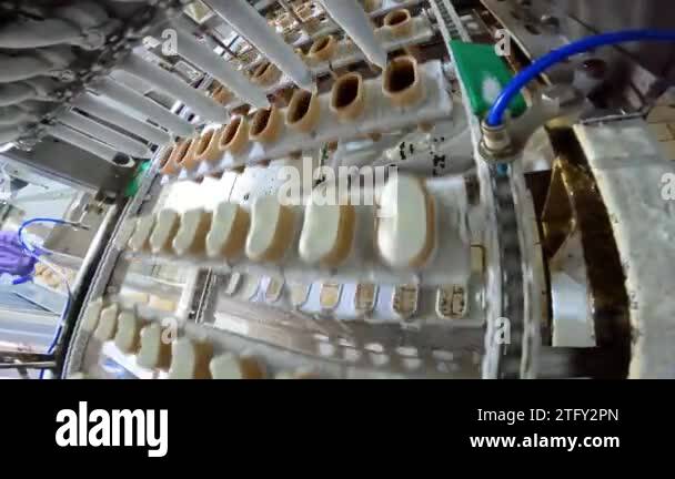 Ice cream production line. A modern conveyor for the production of ice ...