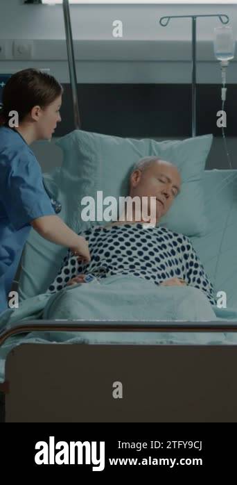 Vertical video: Patient going unconscious in hospital ward after ...