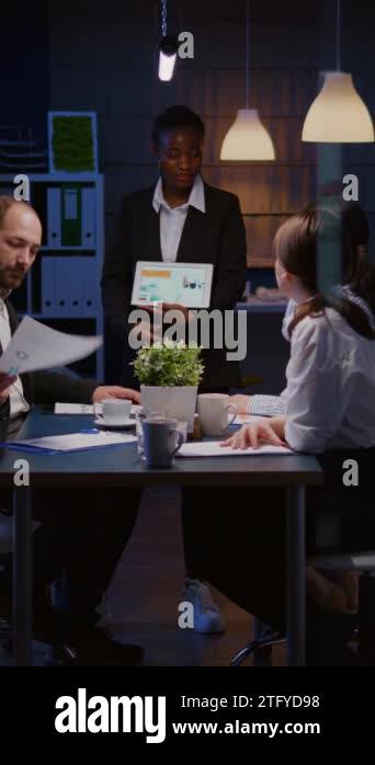 Vertical video: Exhausted workaholic african american showing financial ...