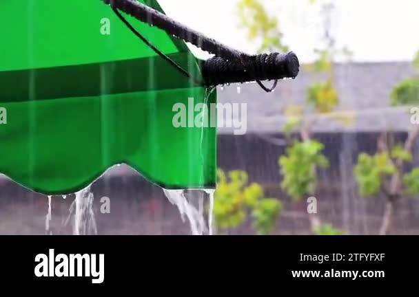 Extreme monsoon rain with flooded roads and details of dripping and ...