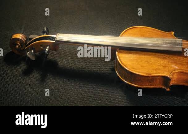 Slow pan across the honey body of a classic violin Stock Video Footage ... Slow pan across the honey body of a classic violin Stock Video Footage ...