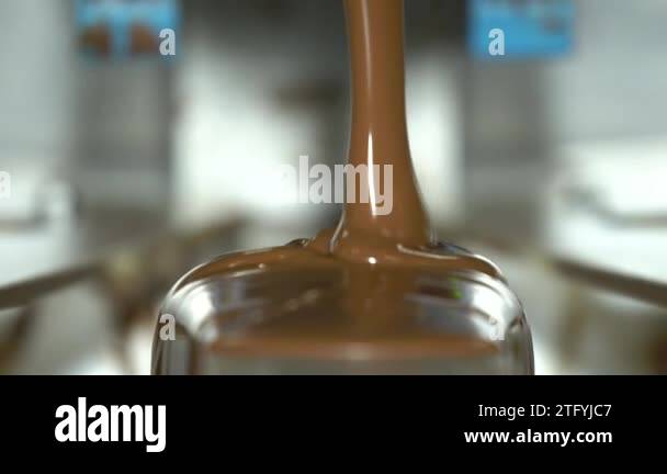 Automated Production line of chocolate pralines in a factory. Different ...