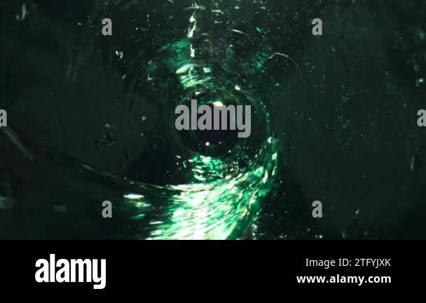 Unfiltered jet foaming glassware closeup. Fresh draft intoxicant liquid ...