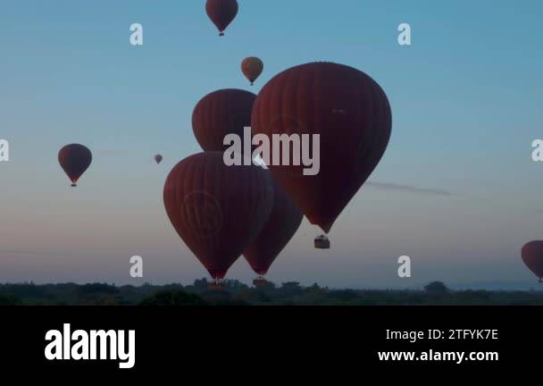 Bagan Myanmar, hot air balloon during Sunrise above temples and pagodas ...