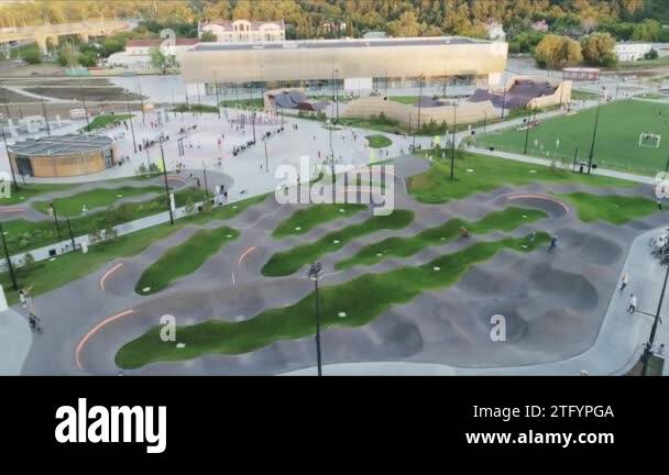 Modern sports ground with equipped courts in large urban park aerial ...