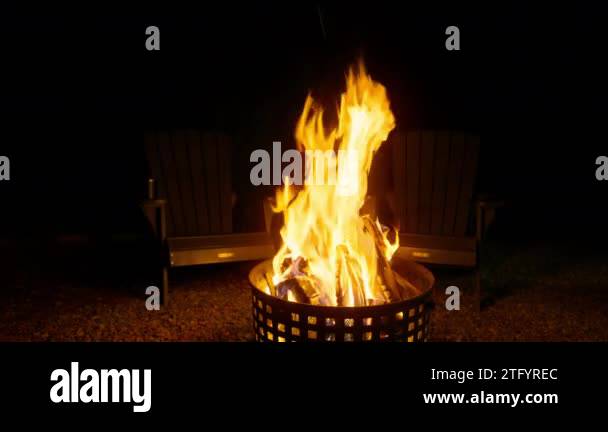 Fire Particles over black background with smoke. Bonfire Burning in ...